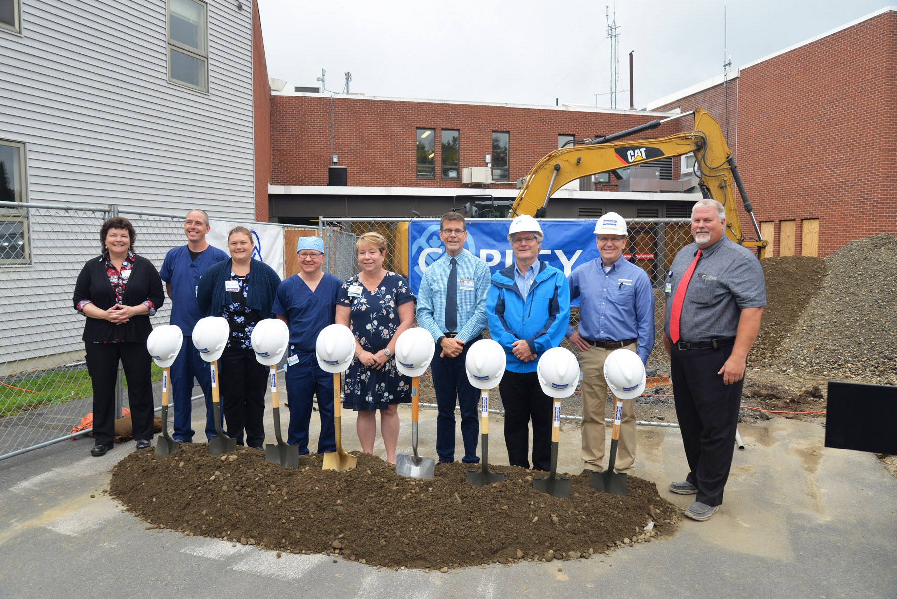 Group_Internal with Connor standing behind hats | Copley Hospital